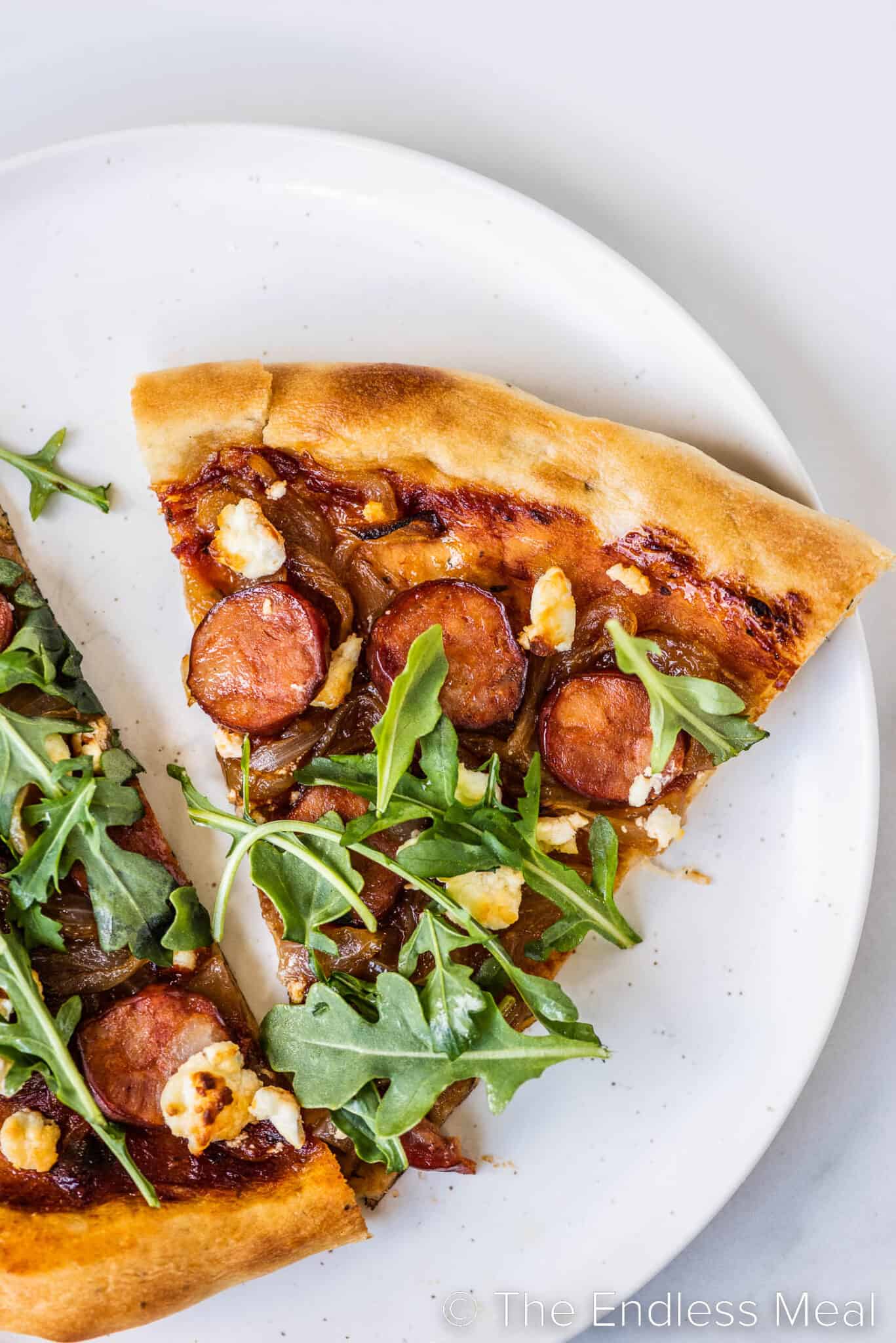 Spicy Chorizo Pizza with Caramelized Onions, Goat Cheese