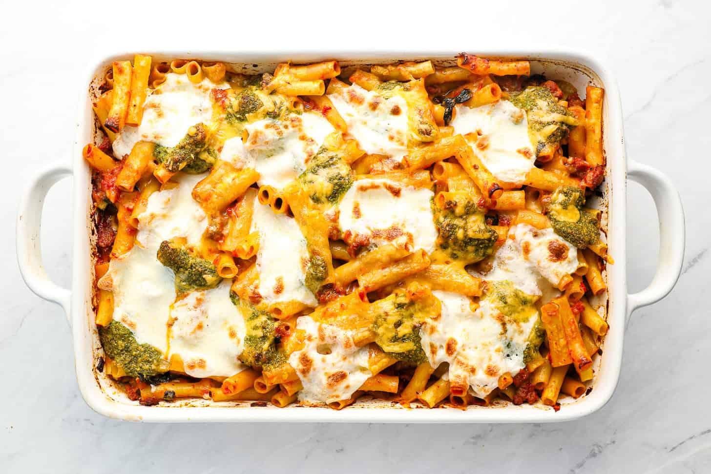 Baked Ziti with Sausage (in tomato sauce topped with pesto)